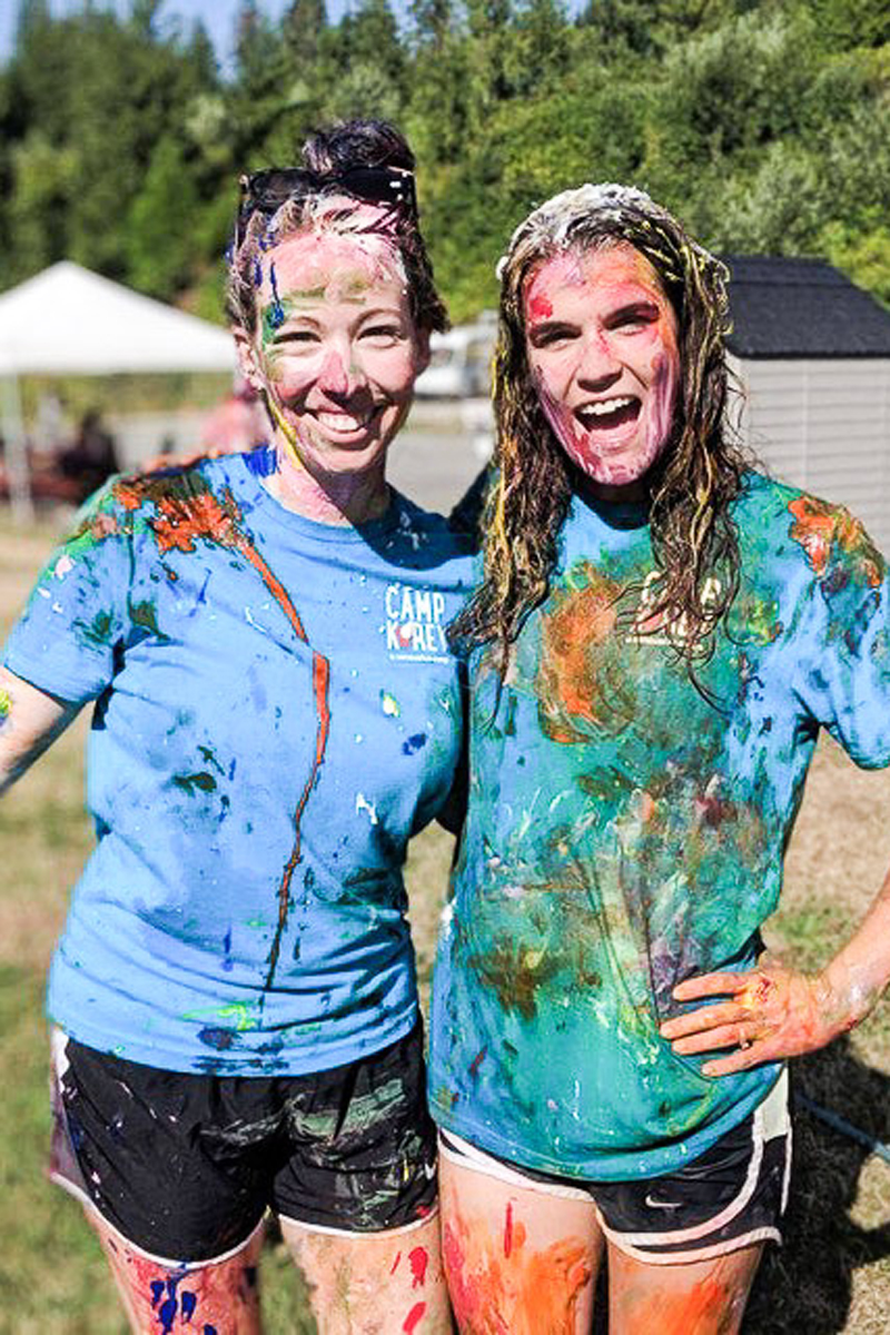 Emily and fellow Camp Korey staff member volunteering at the “Silly ...